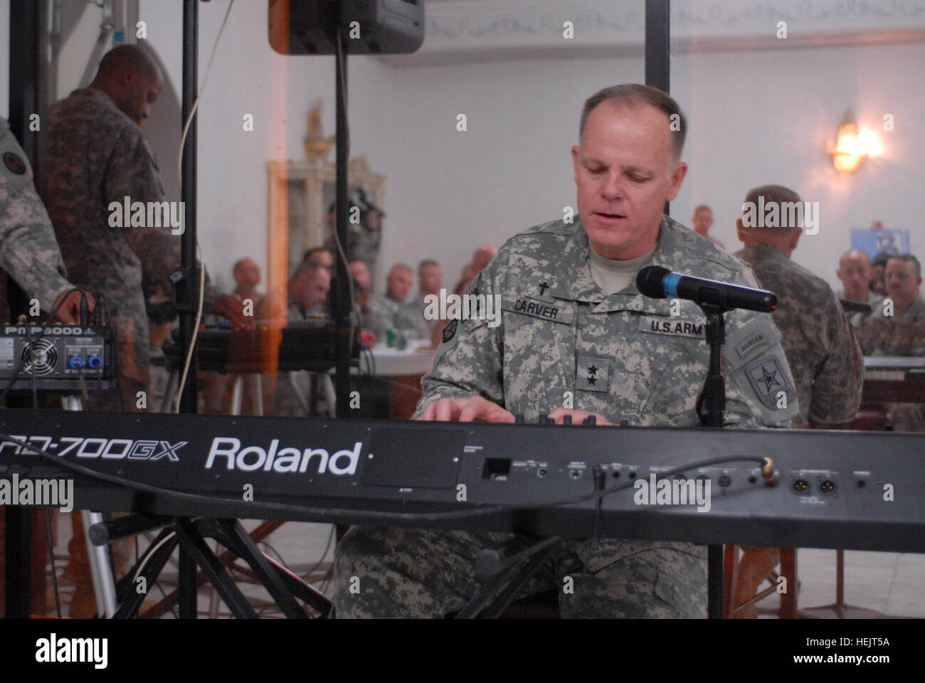 Chief of Chaplains (Maj. Gen.) Douglas Carver plays a song for a crowd ...