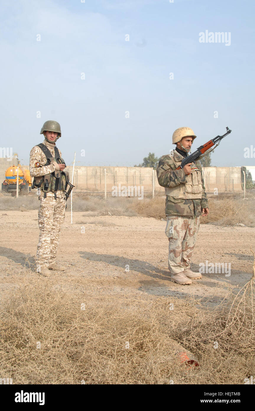 Two Iraqi army soldiers of the 2nd Battalion, 37th Engineer Brigade ...