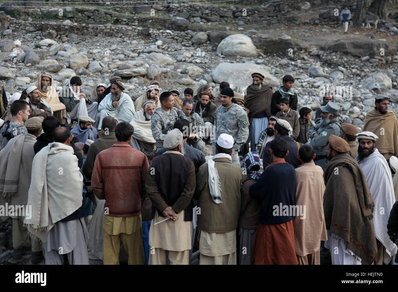 U.S. Navy Cmdr. Leonard Remias, center left, the commander of the Kunar ...