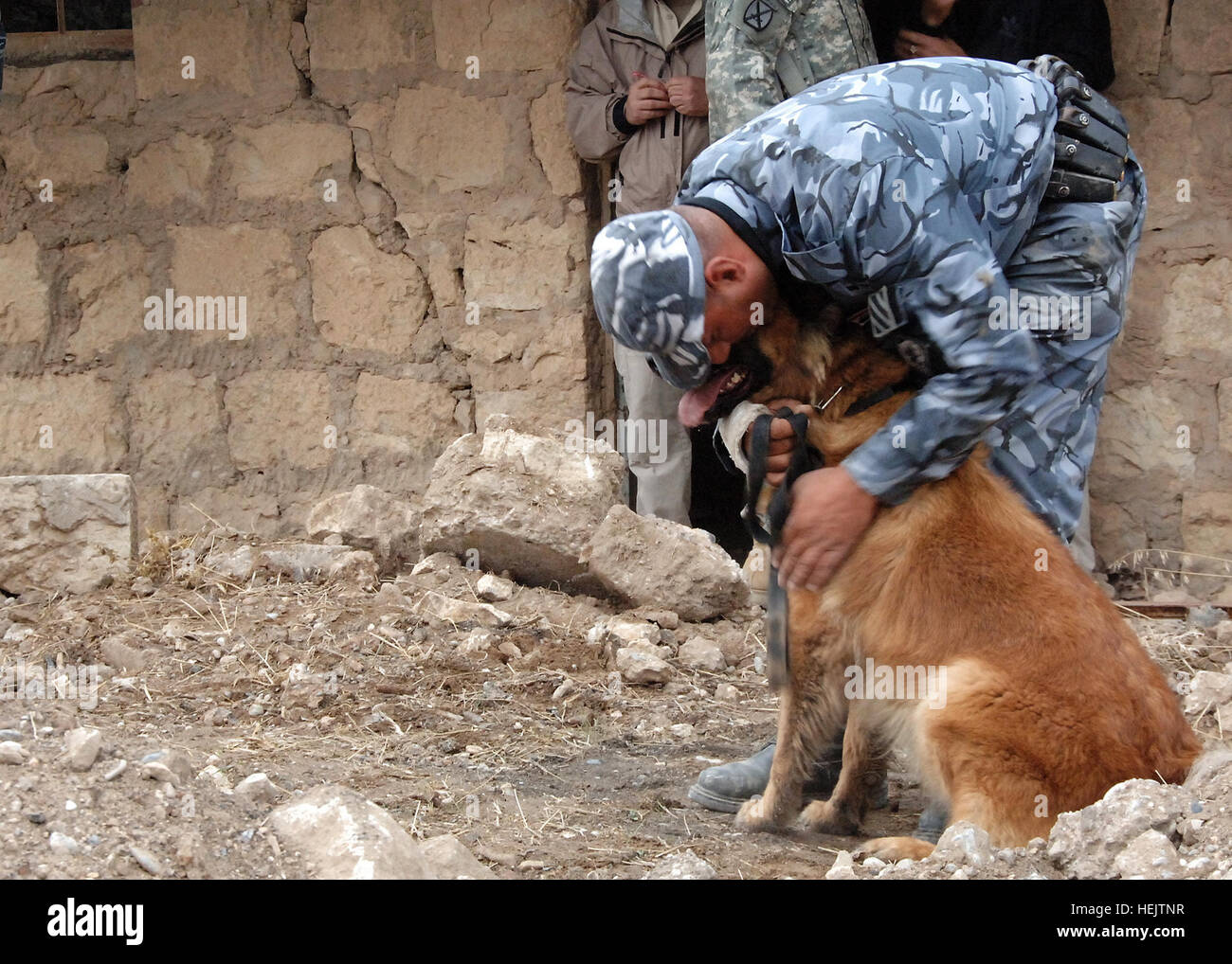 An Iraqi police officer awards his military working dog with hugs and ...