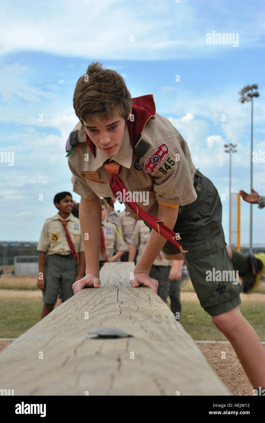 A boy scout traverses a beam during Boy Scout Troop 845's visit to Fort ...