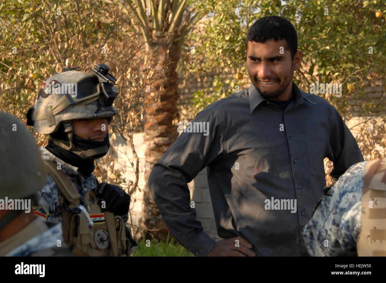 An Iraqi citizen is questioned by Iraqi Army soldiers of the 1st ...