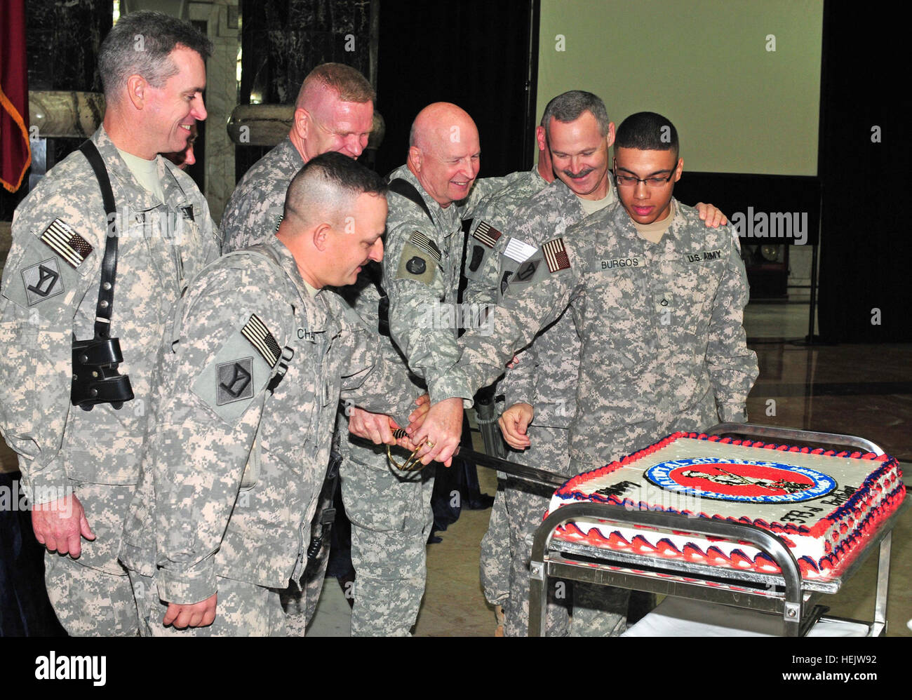 Soldiers cut the National Guard's birthday cake at a celebration at the ...