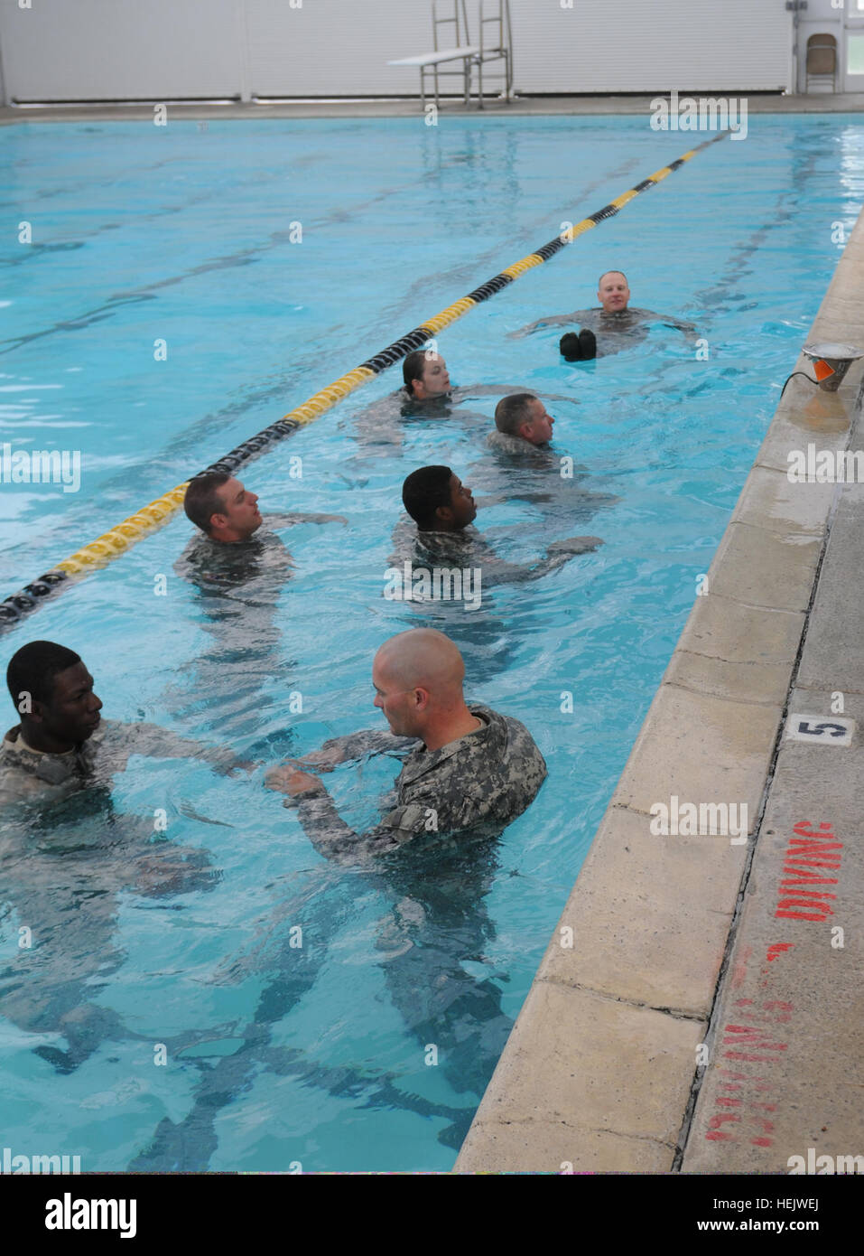 Soldiers with 336th Engineer Company, tread water in the pool as part ...