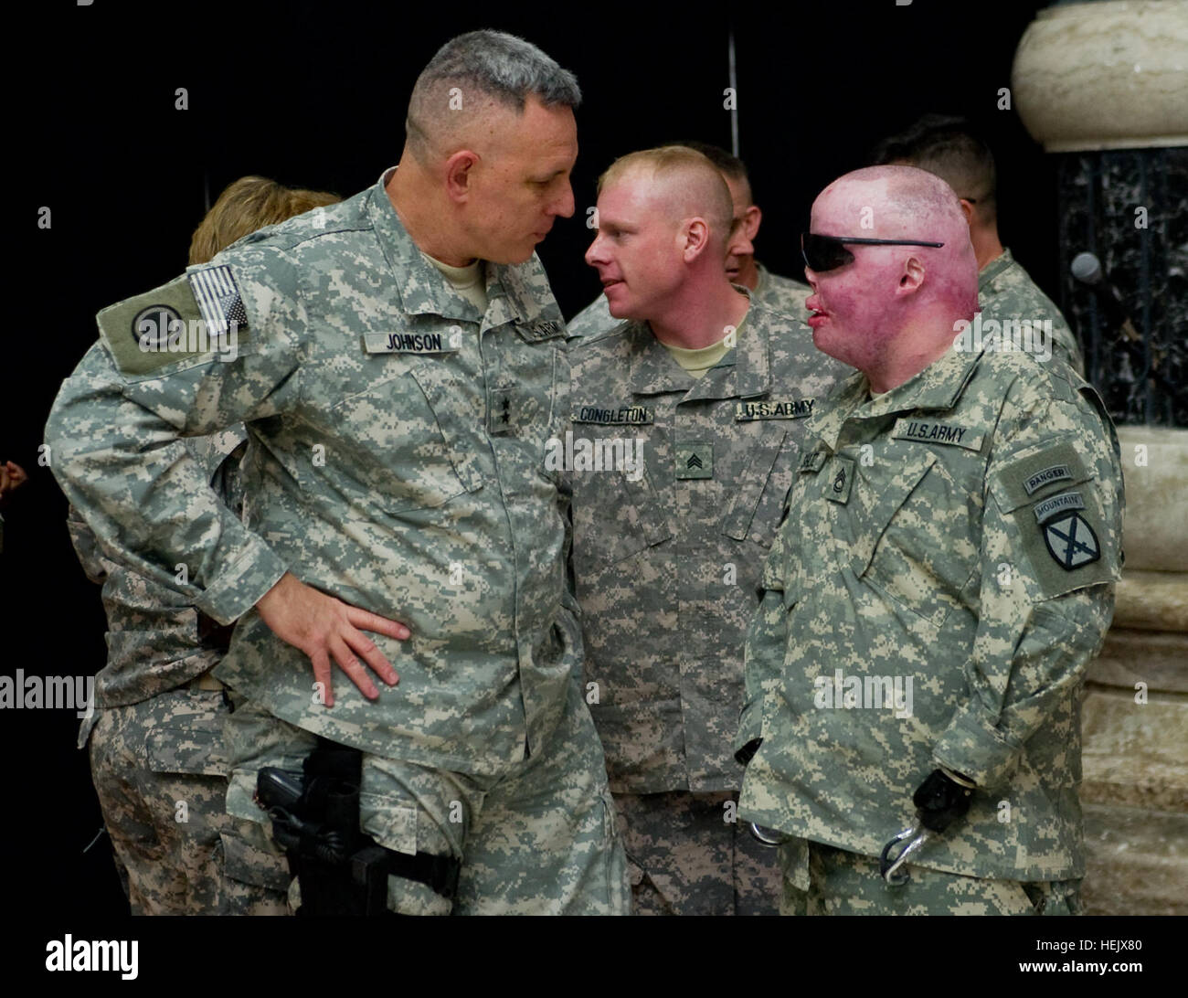 Maj. Gen. John (JD) Johnson and Sgt. 1st Class Mike Schlitz share a ...