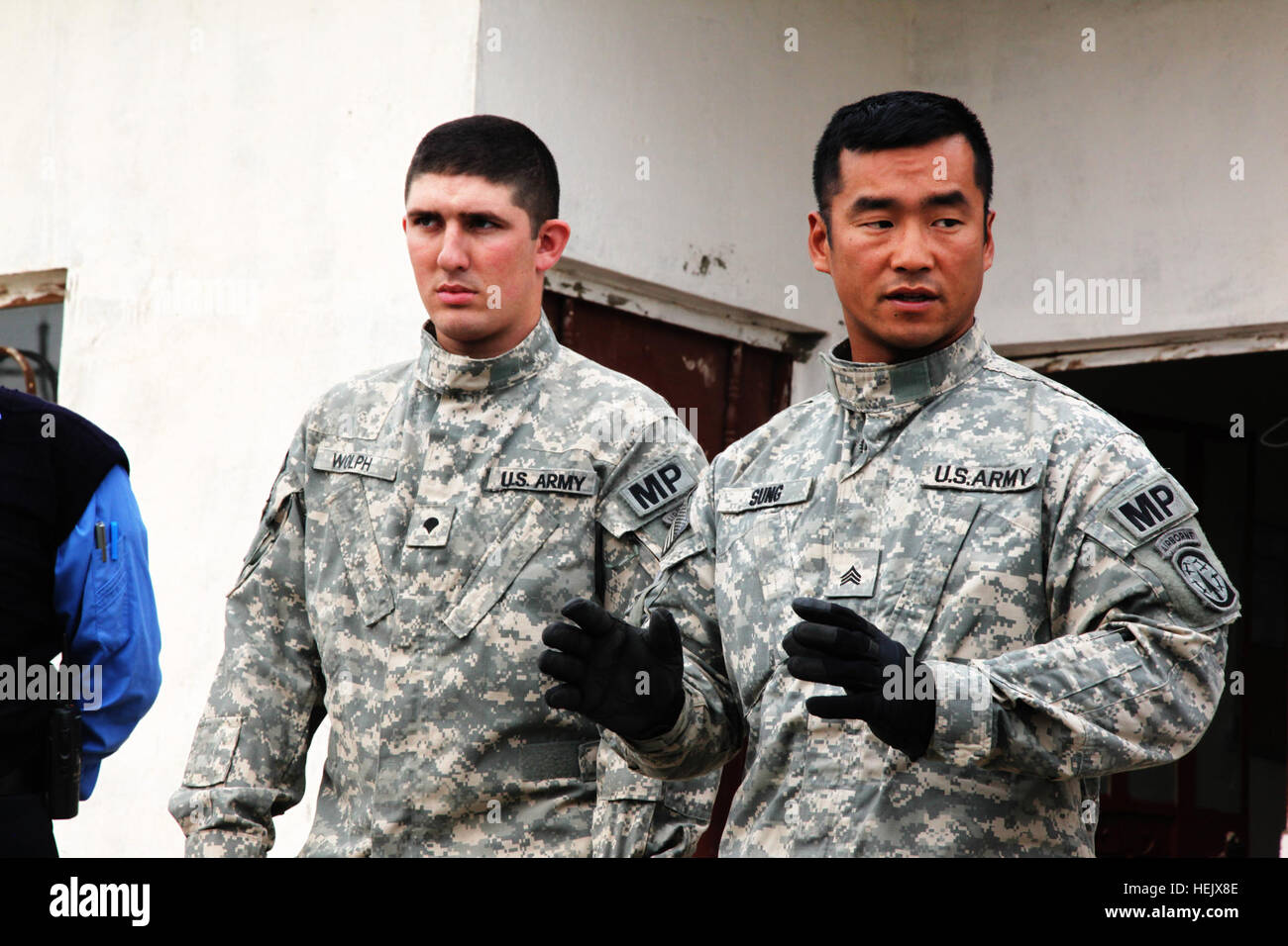 U.S. Army Sgt. Suhun Sung and Specialist Ricky Wolph from the 218th ...