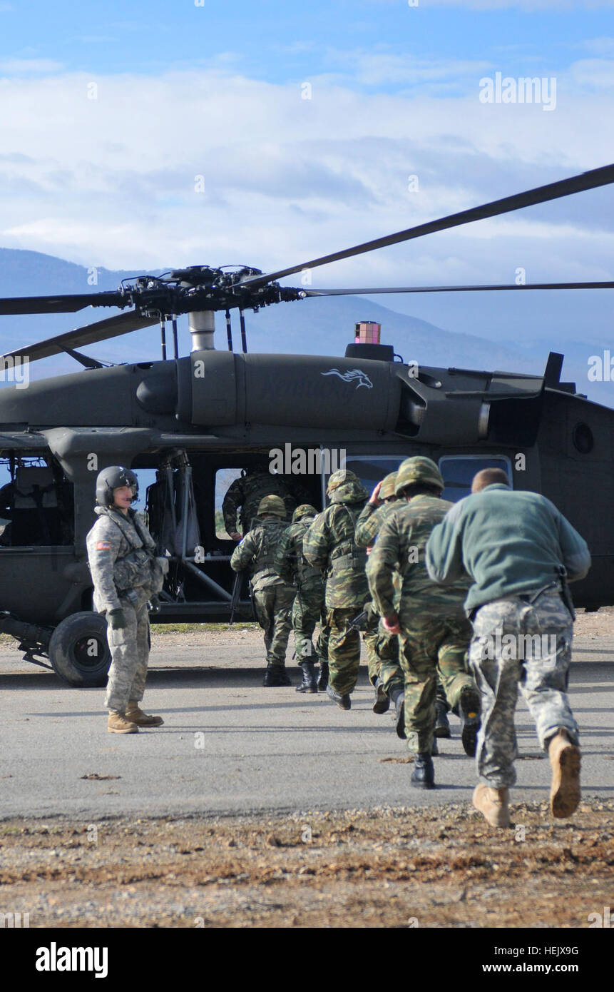 Greek soldiers board the UH-60 Black Hawk helicopter during hot/cold ...