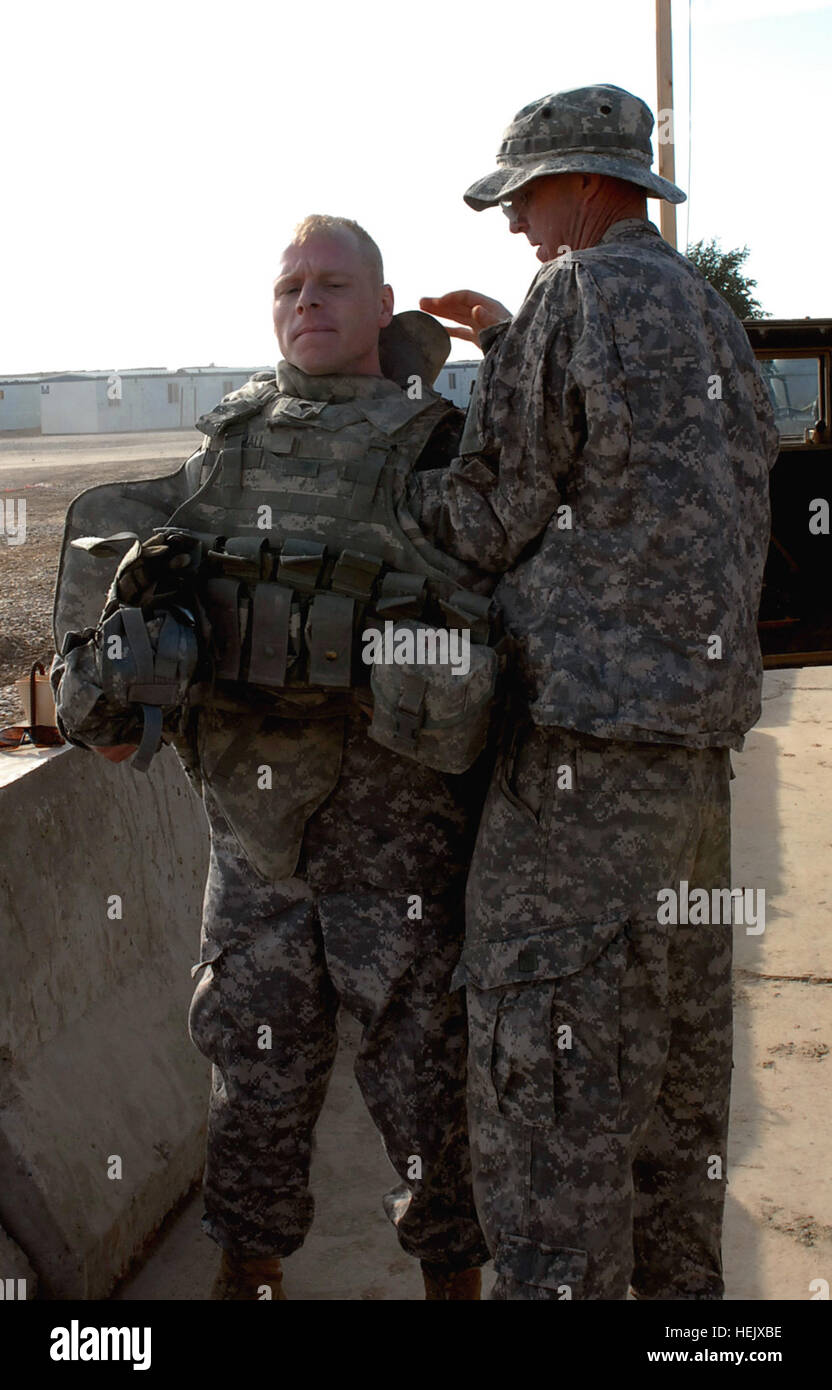 Sgt. William Congleton (left), of Sutherlin, Ore., tries on an Improved ...