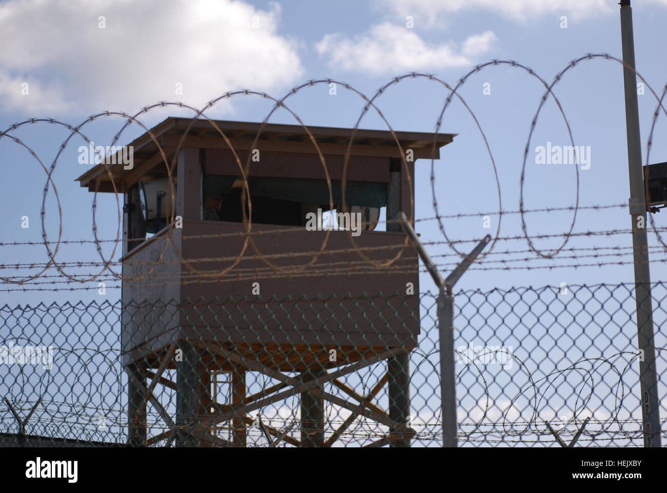 A Soldier stands guard in a tower at Camp Delta at Joint Task Force ...