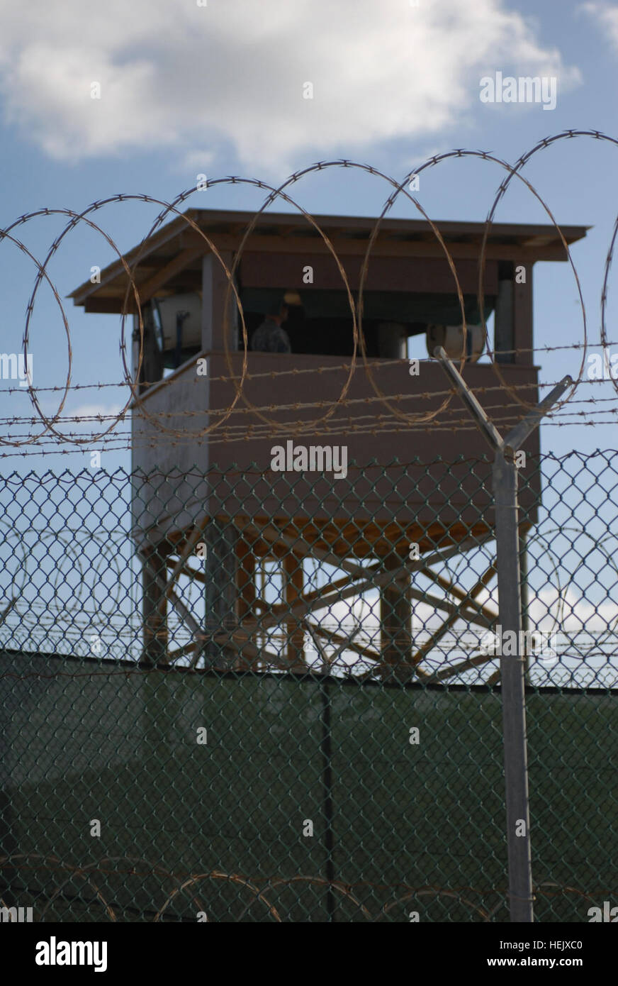 A Soldier stands guard in a tower at Camp Delta at Joint Task Force ...
