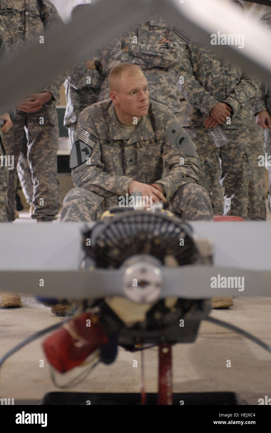 Sgt. Bill Congleton is seen through the tail of an unmanned aerial ...