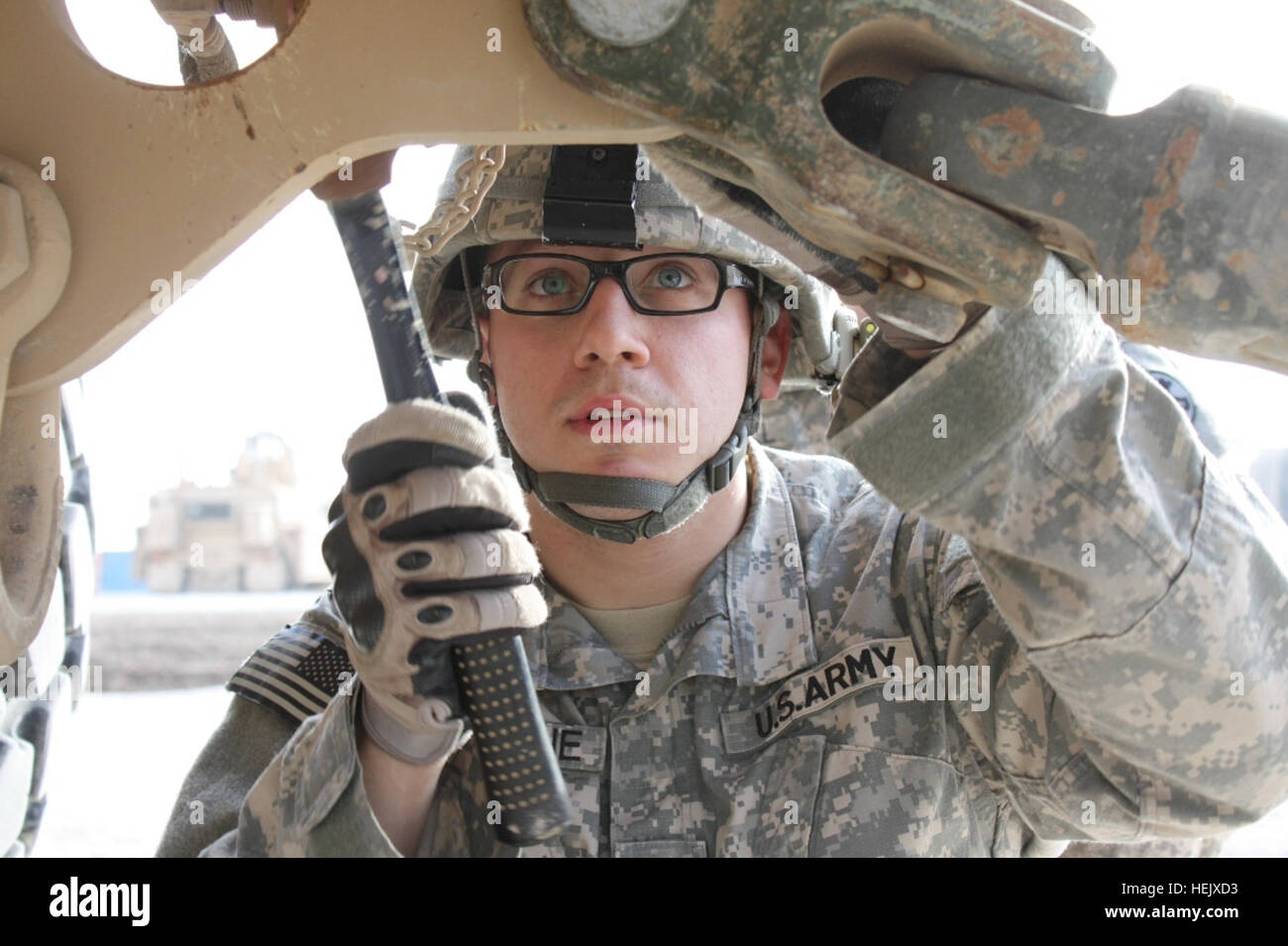 Hammering a cotter pin in place, Spc. James Perrone of Peabody, Mass ...