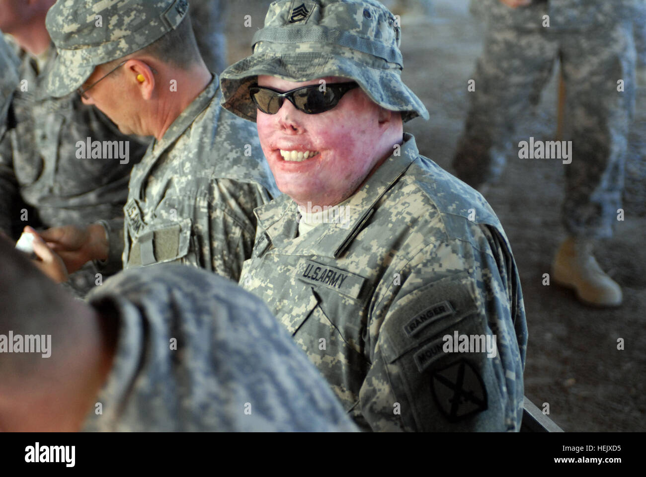 Sgt. 1st Class Mike Schlitz smiles while watching an Iraqi special ...