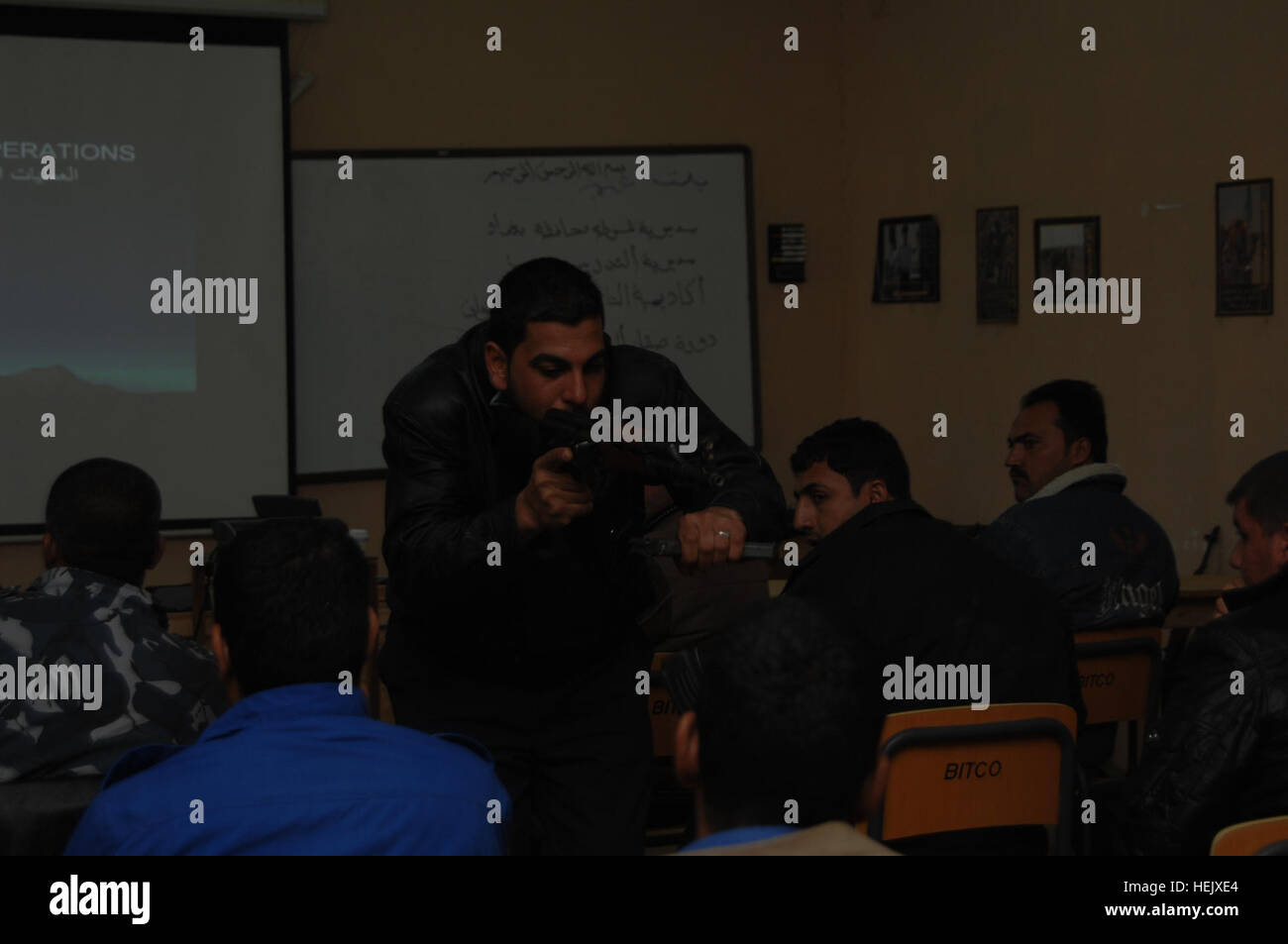 Iraqi Police perform a quick reload on the AK-47 while moving at Camp ...