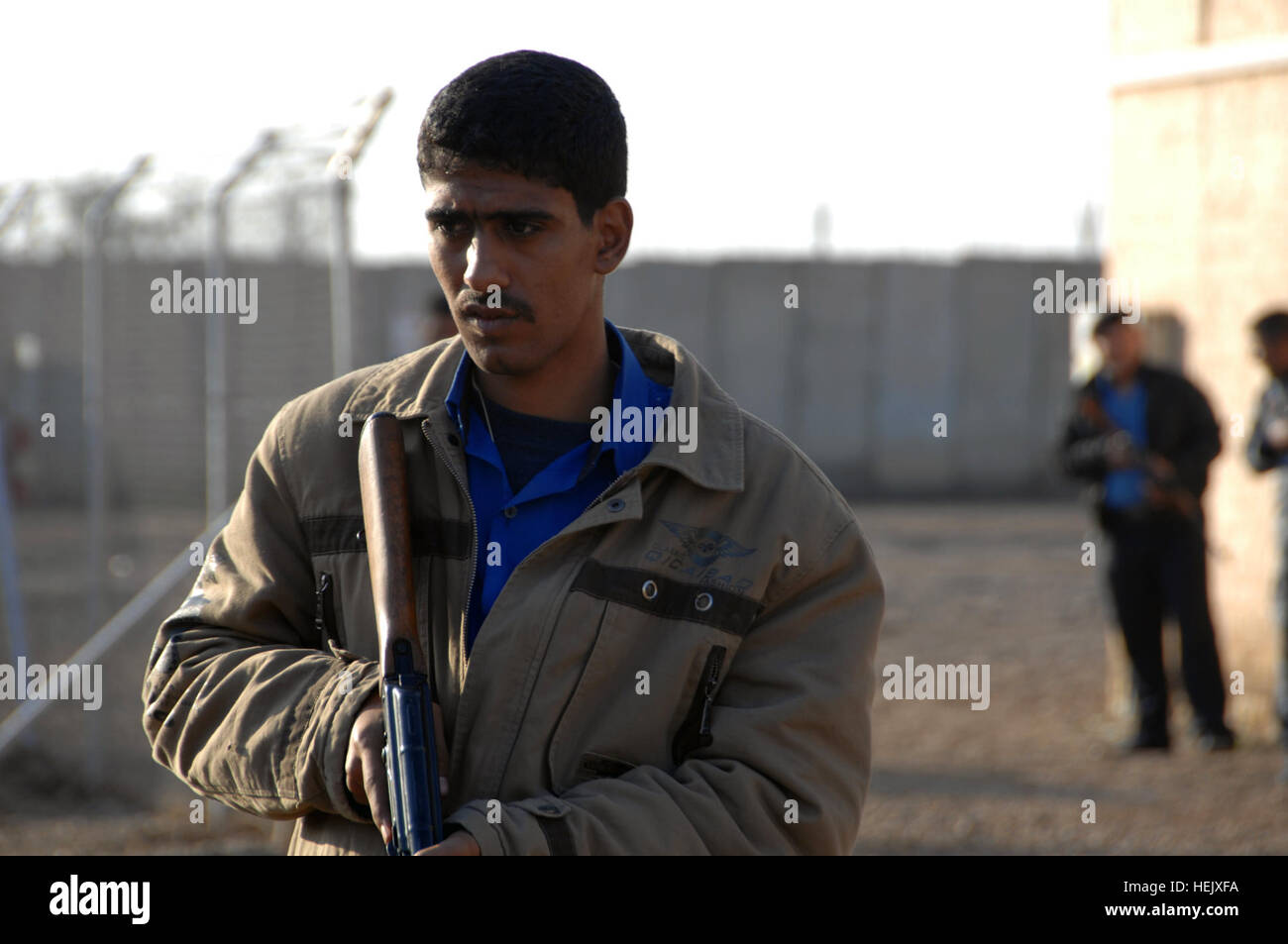 An Iraqi police officer looks for Improvised Explosive Device at the ...