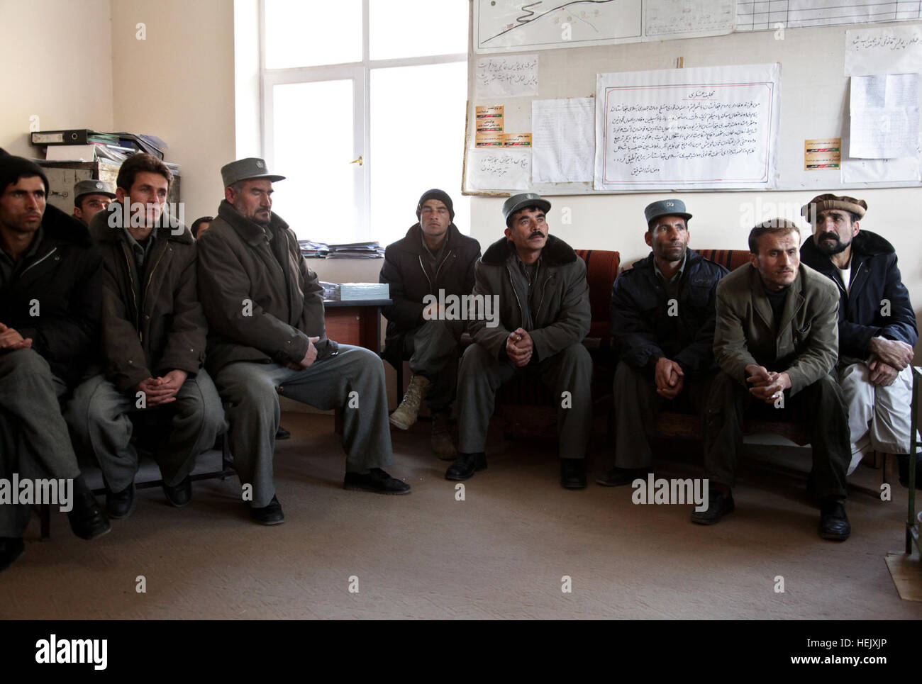 Afghan national police officers listen to U.S. Air Force Lt. Col. Eric ...