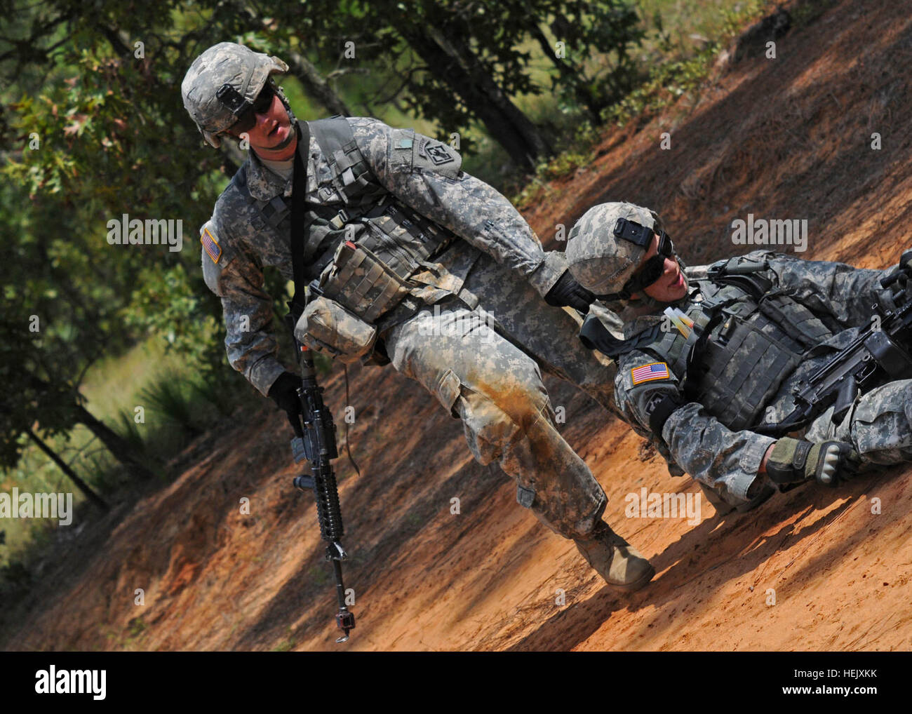 A soldier with 264th Clearance Company, 27th Engineer Battalion, pulls ...