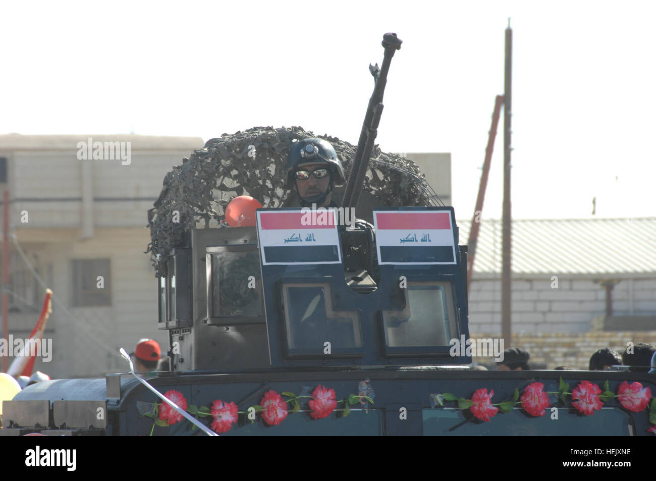 An Iraqi Special Weapons and Tactics officer sits in the turret of a ...