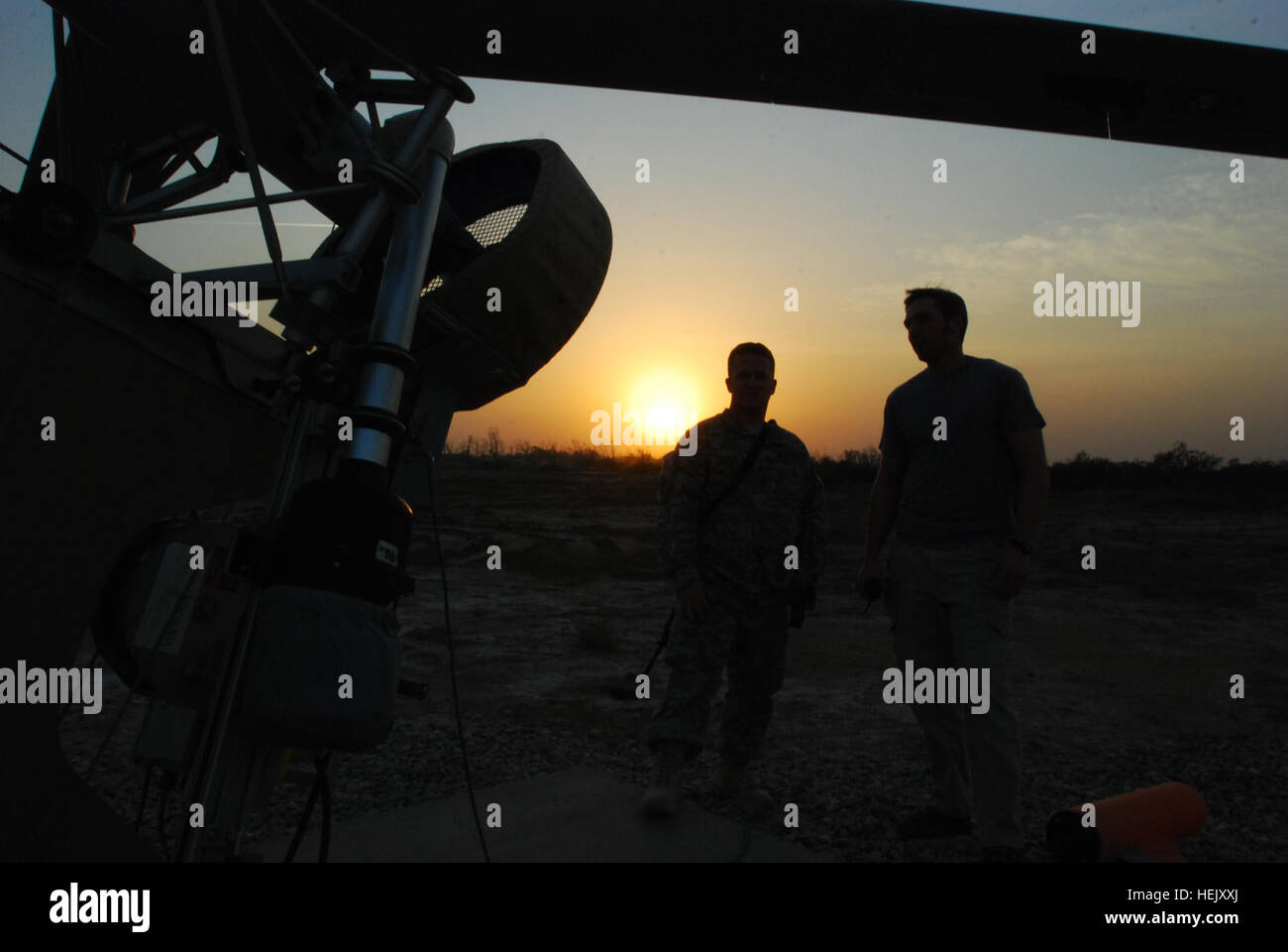 A U.S. Soldier and military contractor wait for the scheduled launch of ...