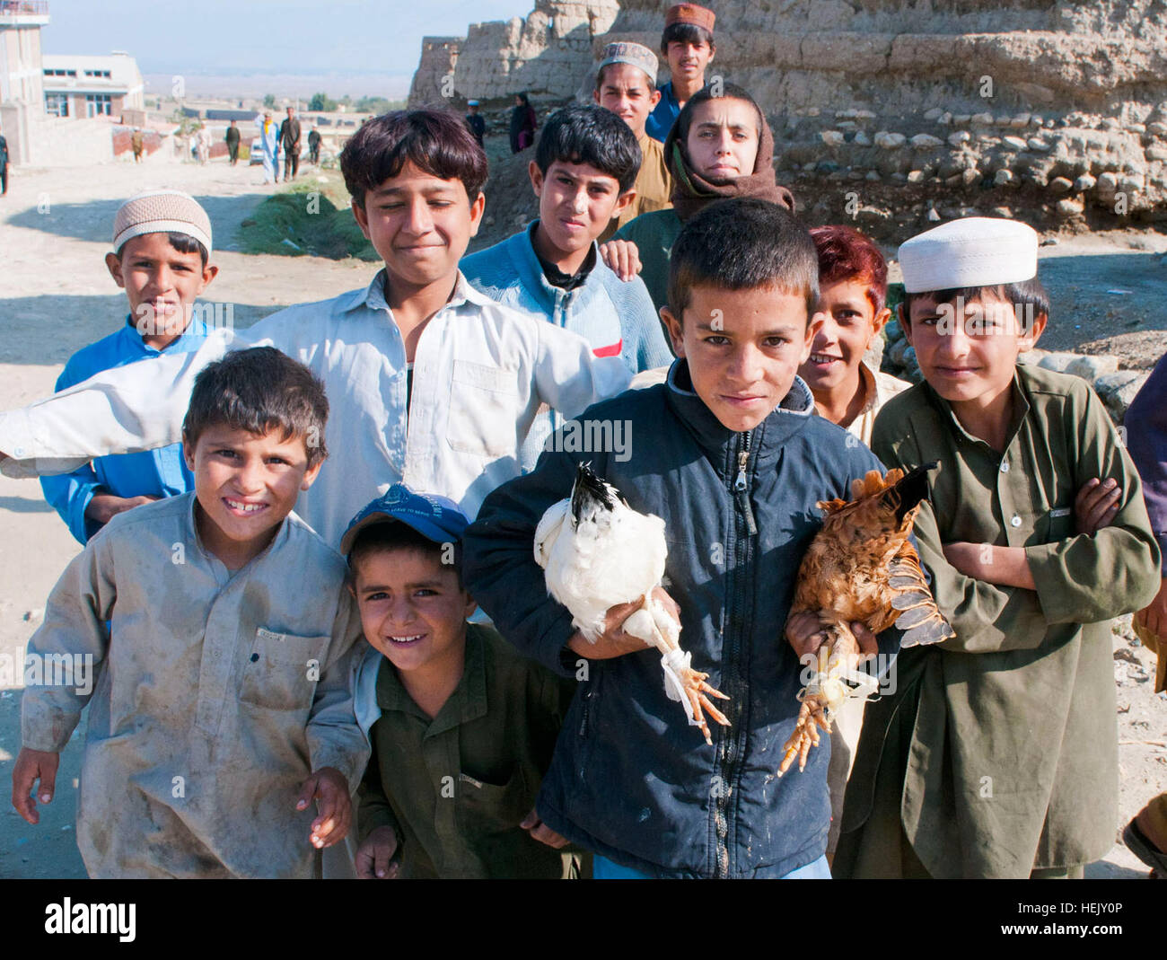 Afghan boys pose for the camera outside the Achin District Center in ...