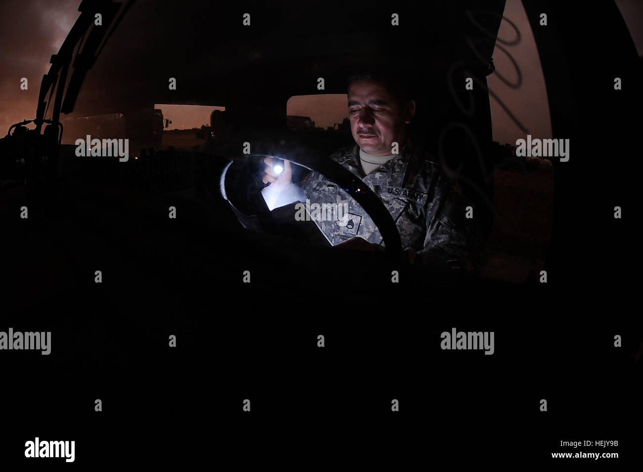 Army Reserve Staff Sgt. Francisco Pinzon, reviews the convoy route at ...