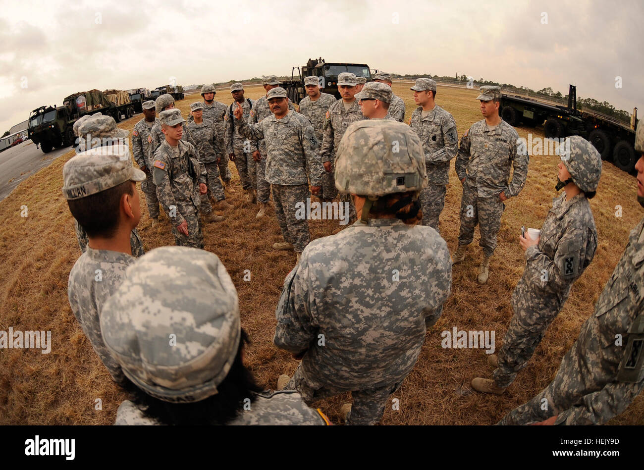 Army Reserve Sgt. 1st Class Edwin Lopez, center, briefs the convoy ...
