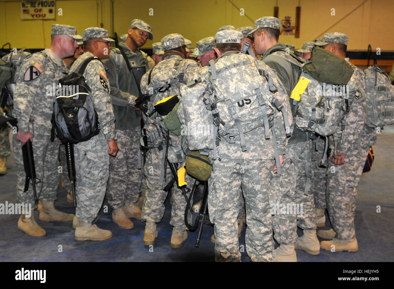 Soldiers from E Btry., 1st Battalion, 44th ADA Regt., huddle together ...