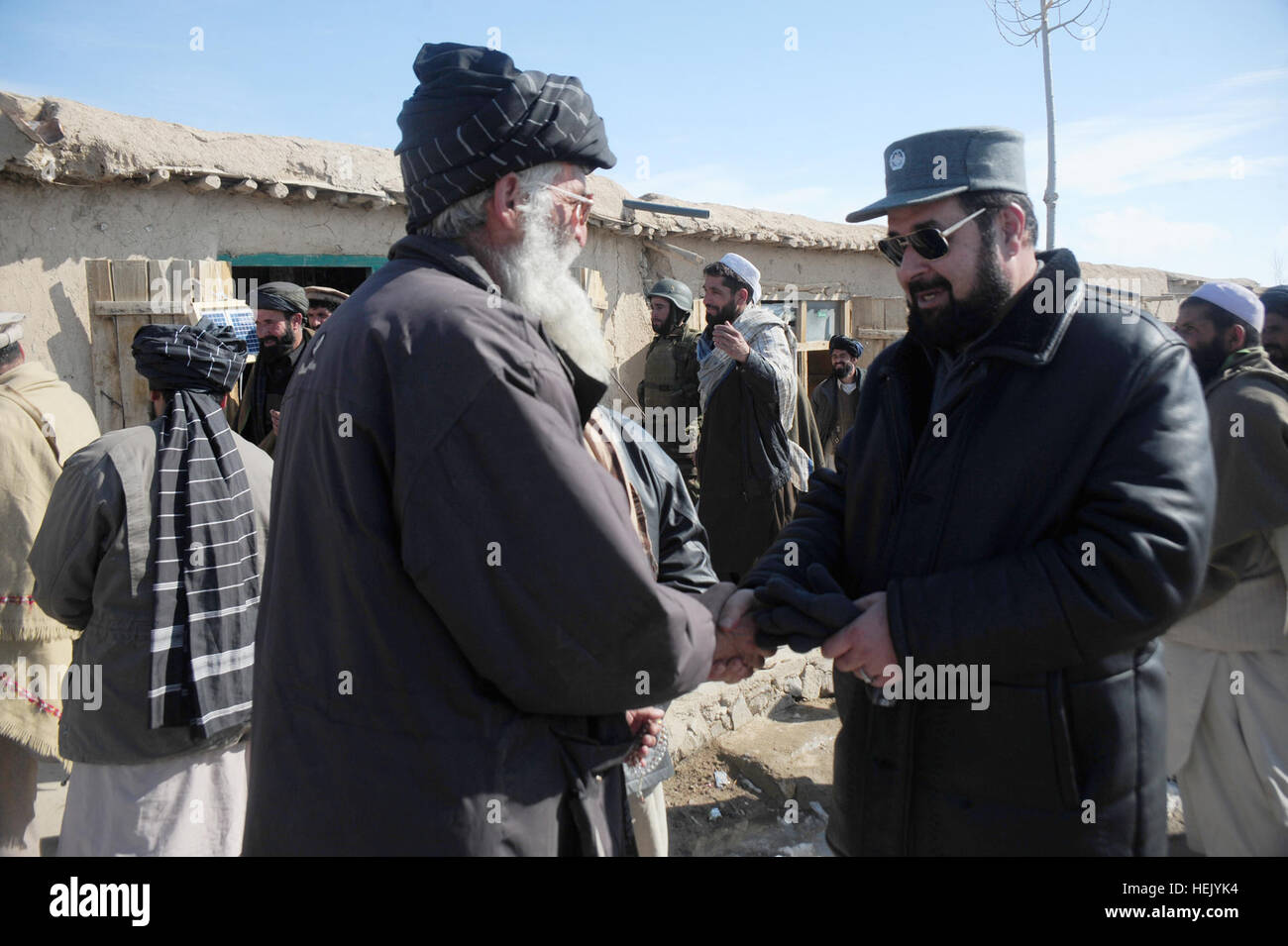 The Afghani national police commander greets a man in the village ...