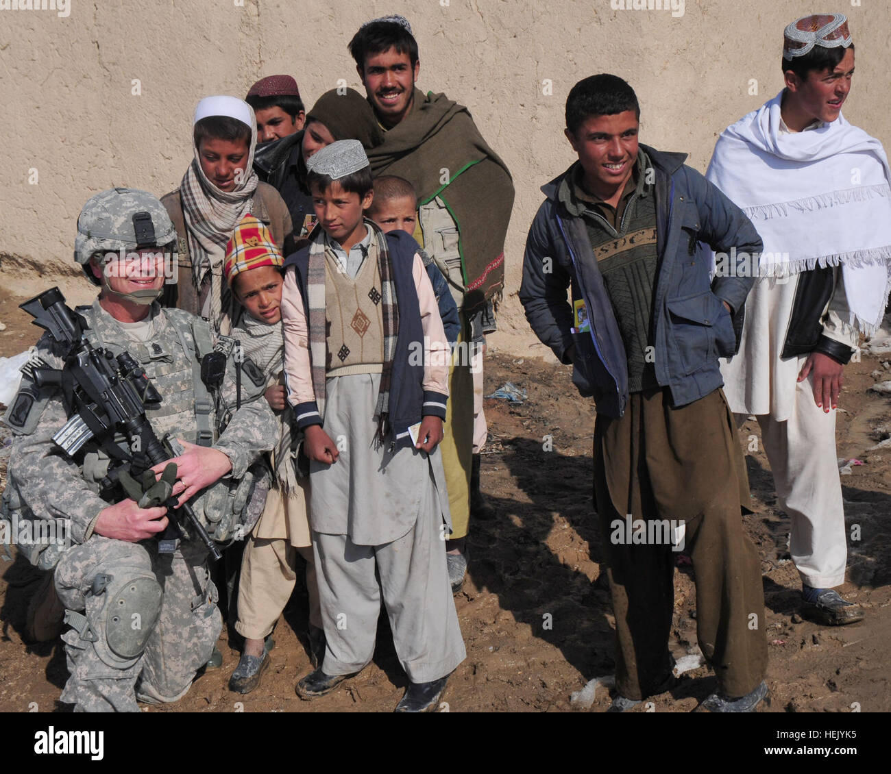 U.S. Army Sgt Maj. John Bagby gets a photo with the children of Jaghato ...