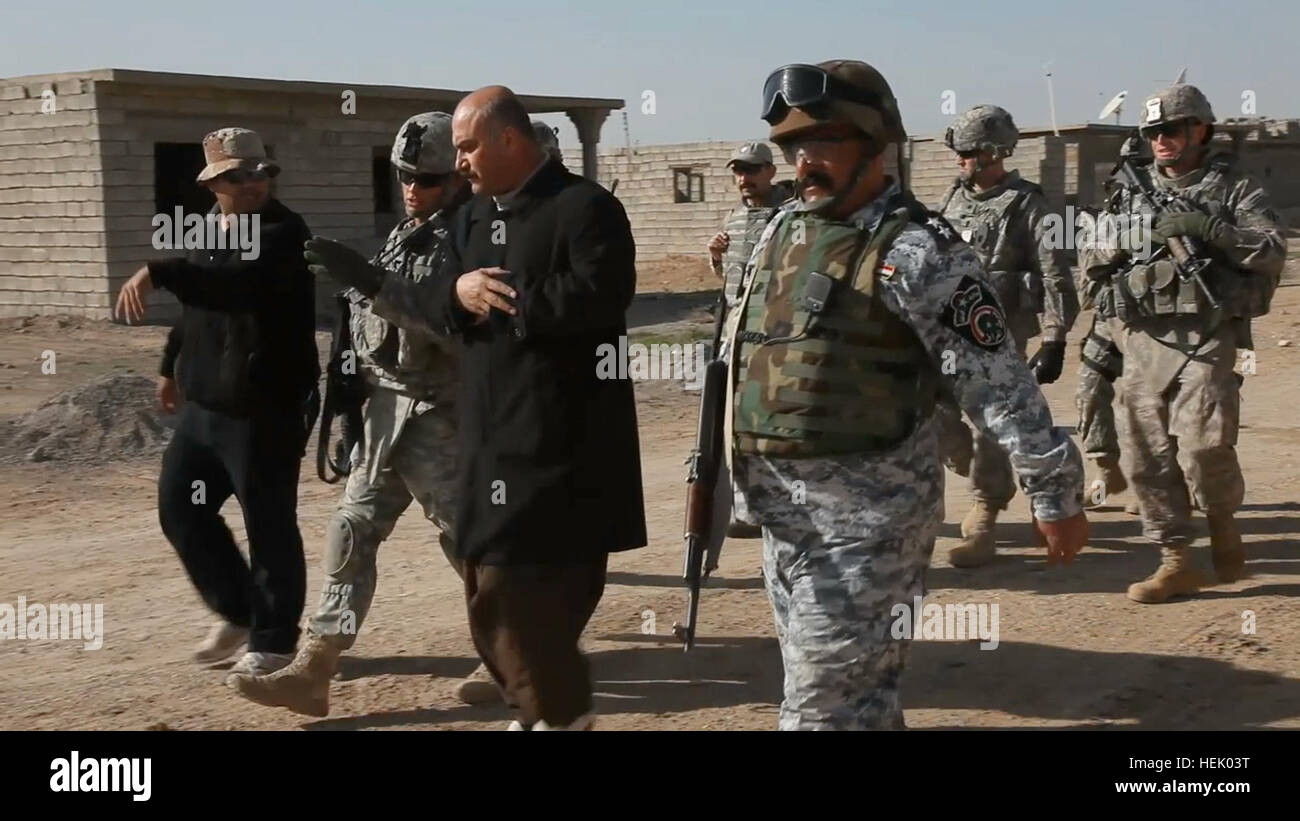 A U.S. Army soldier and an Iraqi police officer conduct a key leader ...