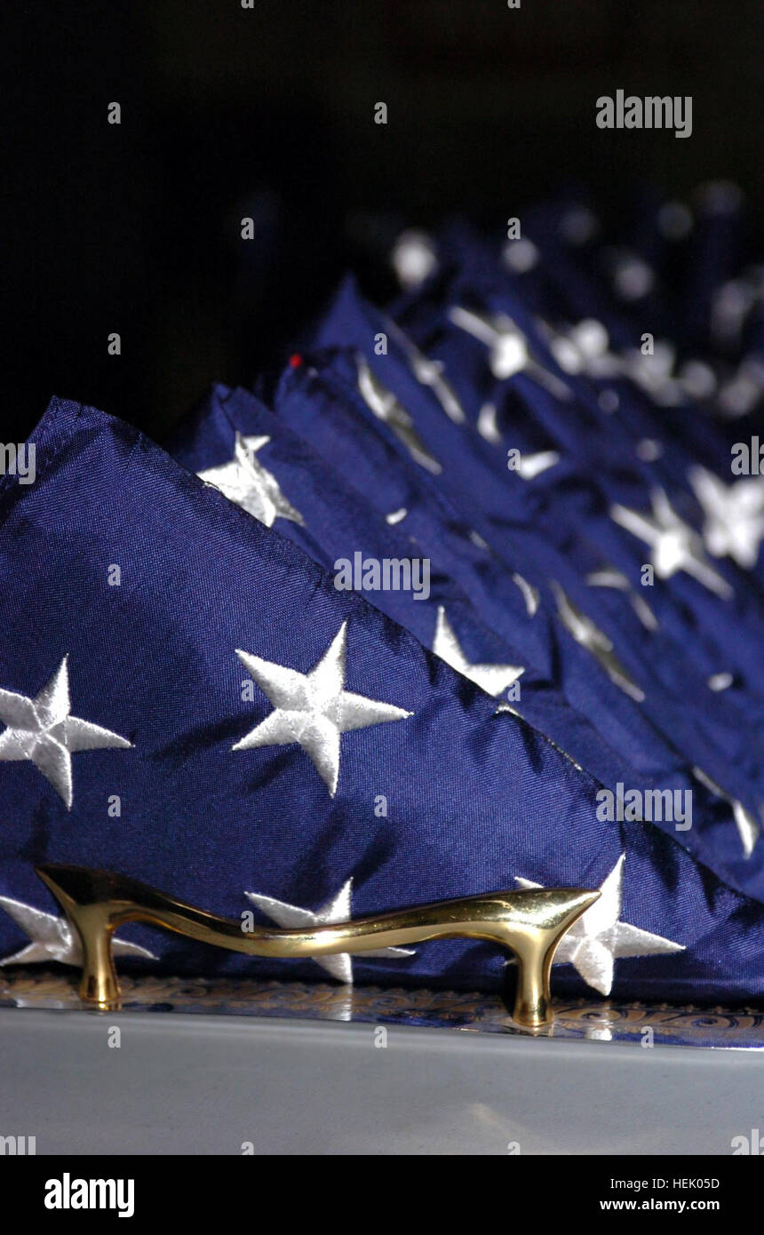 U.S. flags are lined up and ready to be handed out to service members ...