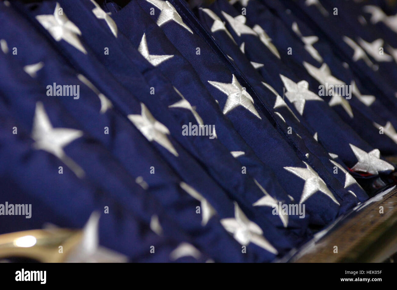 U.S. flags are lined up and ready to be handed out to service members ...