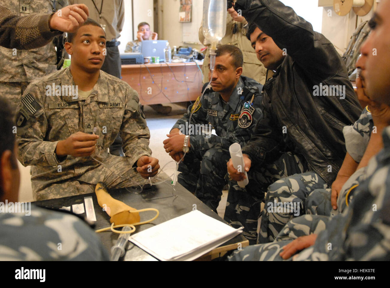Pfc. Nick Puga of Sherman, Texas, and an animal care specialist with ...