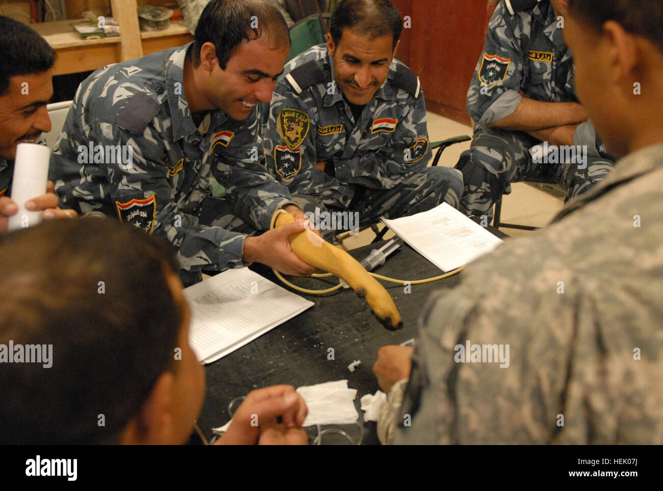 Pfc. Nick Puga of Sherman, Texas, and an animal care specialist with ...