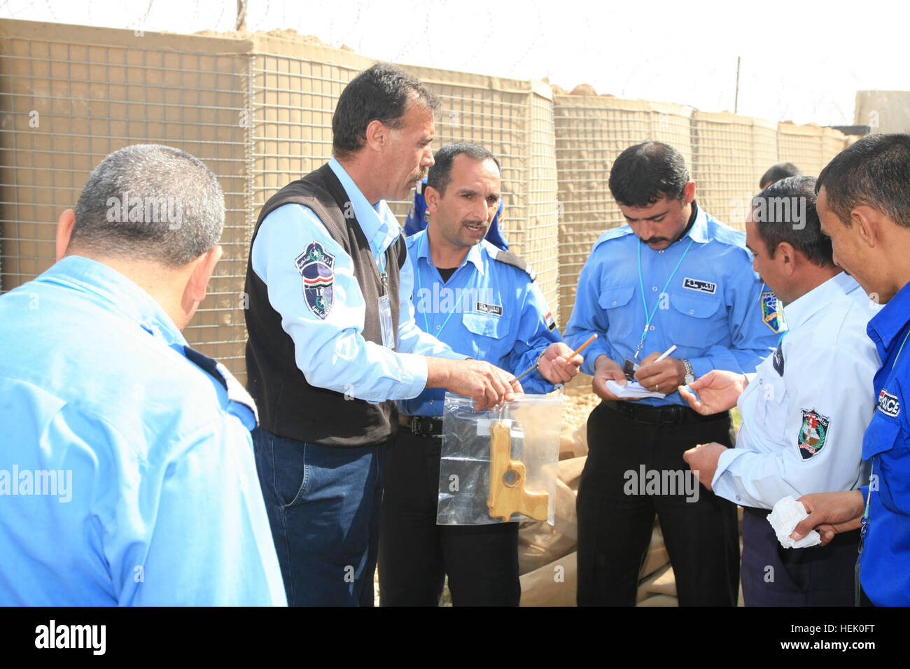 Iraqi policemen and Emergency Response Battalion members conduct a ...