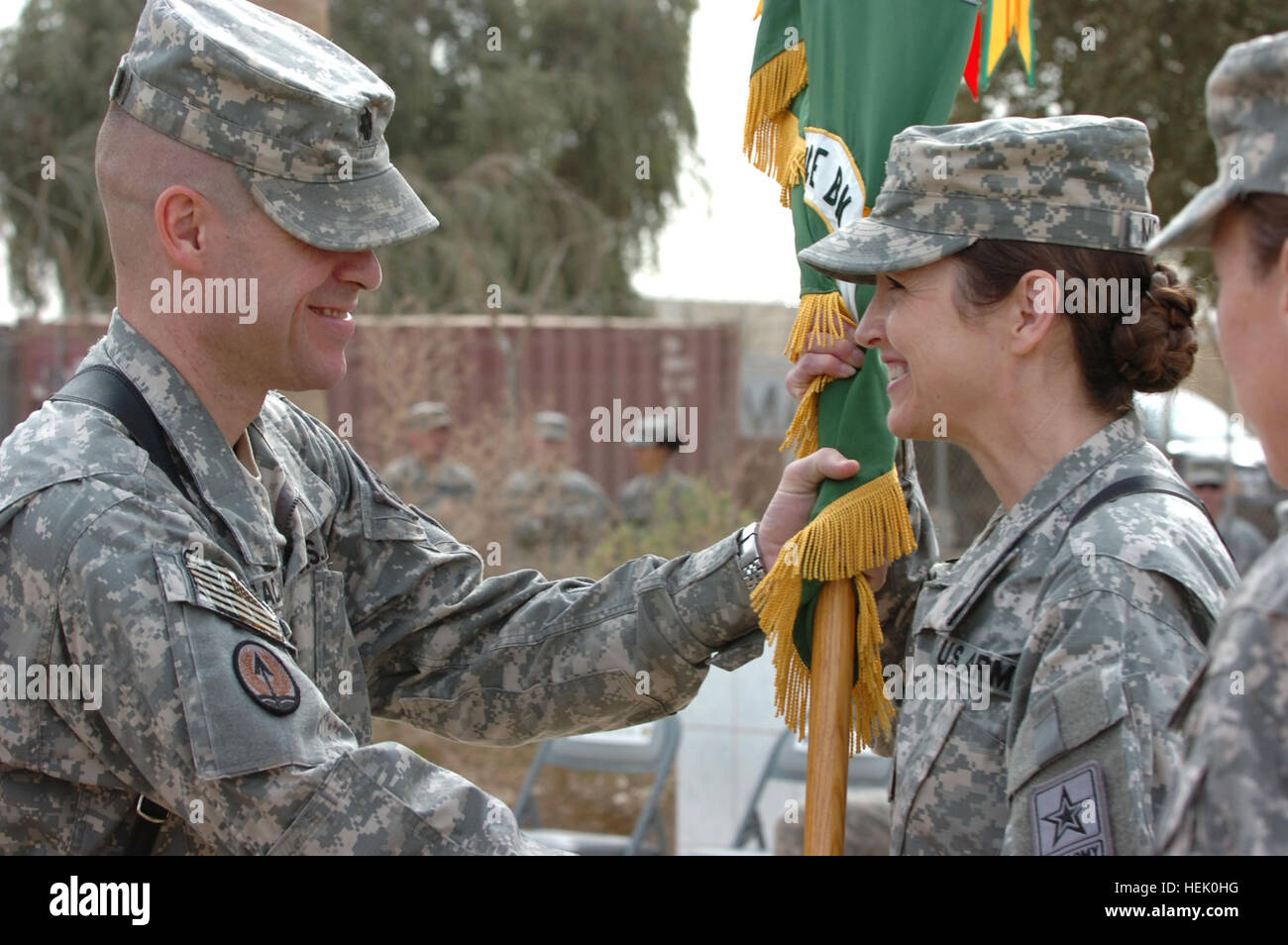Lt. Col. Mark Jackson passes the battalion colors to Brig. Gen. Colleen ...