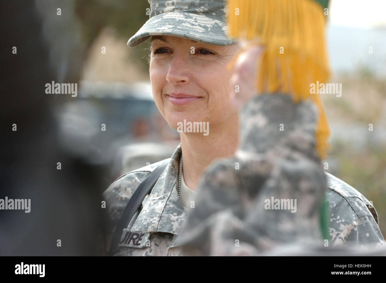 Brig. Gen. Colleen McGuire passes the battalion colors to Lt. Col ...