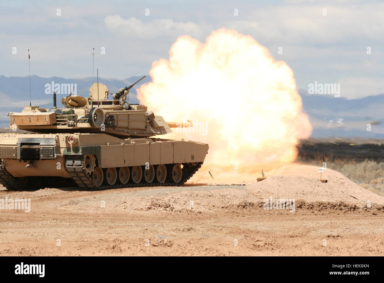 An M1A2 Abrams tank fires at simulated enemy targets during a gunnery ...