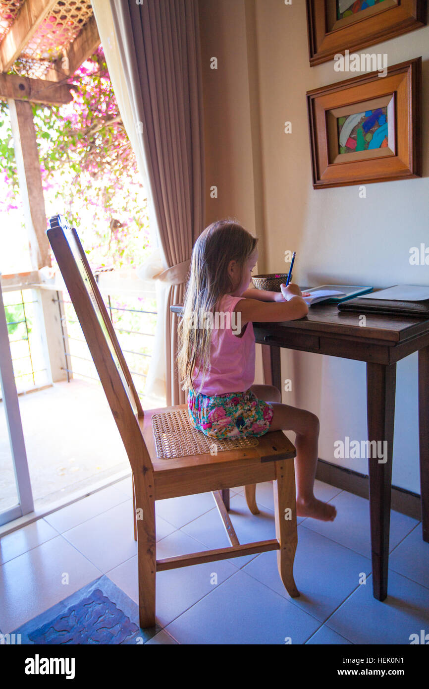 Little girl writing a letter Stock Photo - Alamy