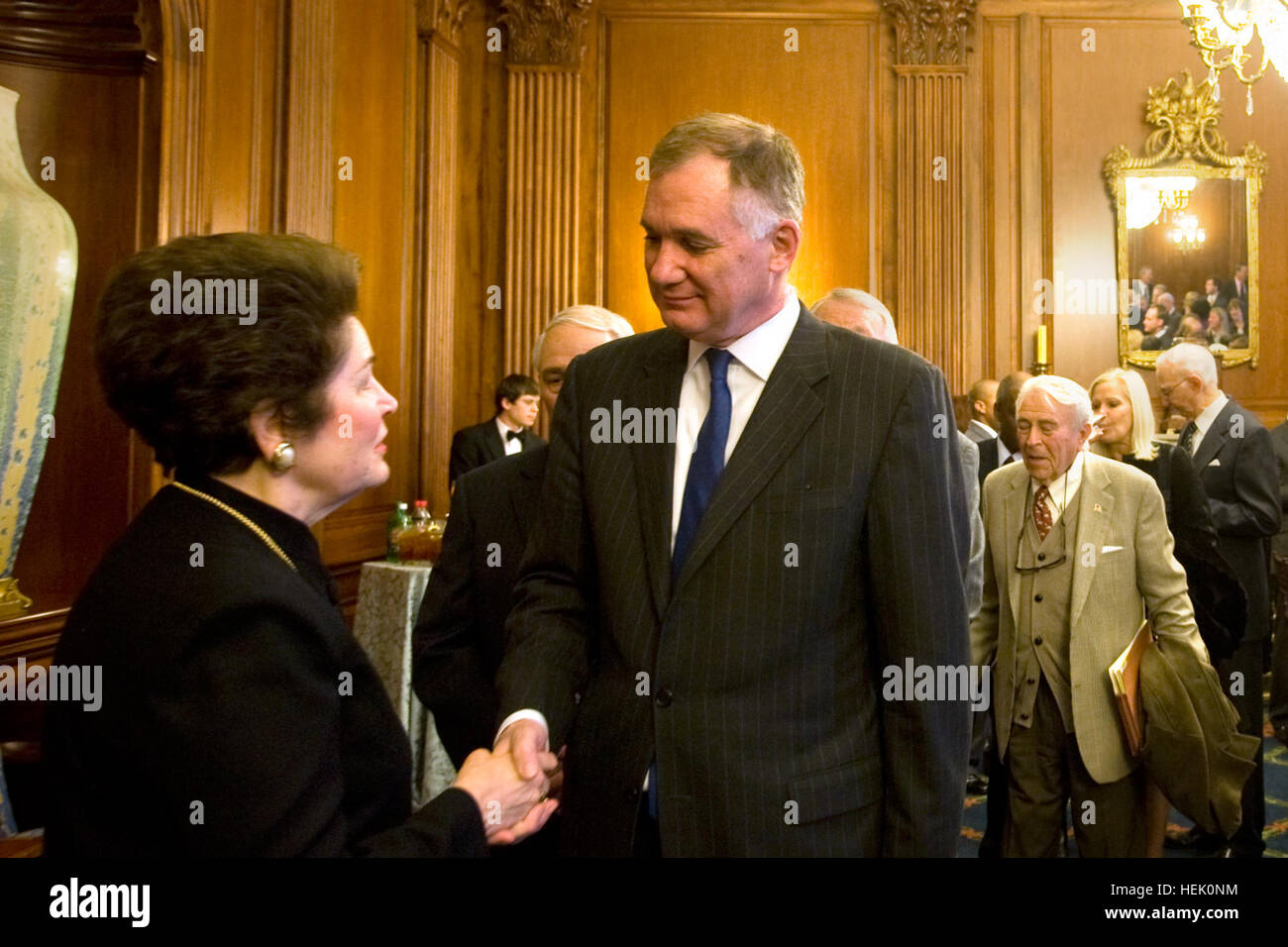 Deputy Defense Secretary William J. Lynn, III, shakes hands with Joyce ...