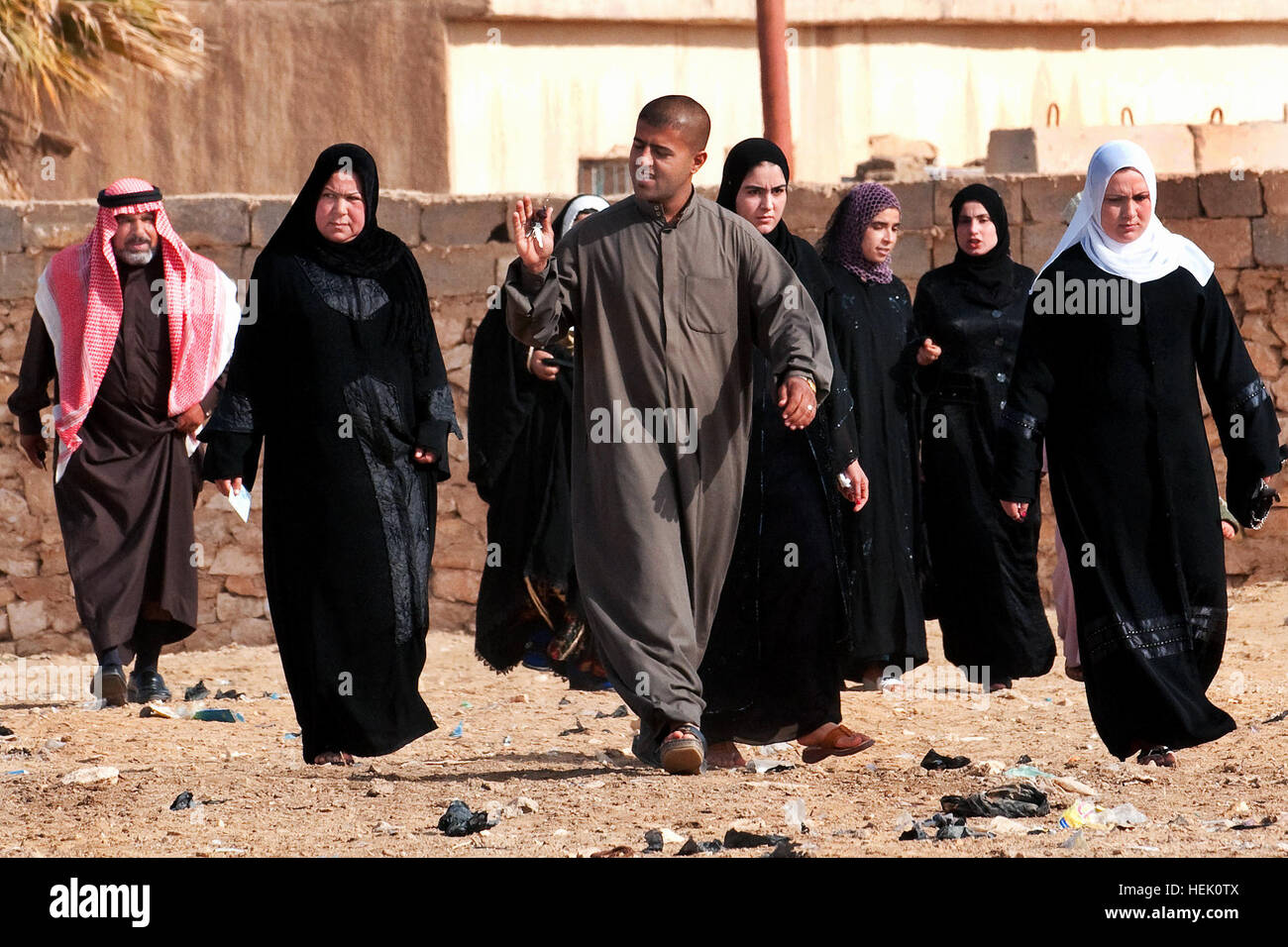 A resident of Ramadi smiles while looking at his dyed purple finger ...