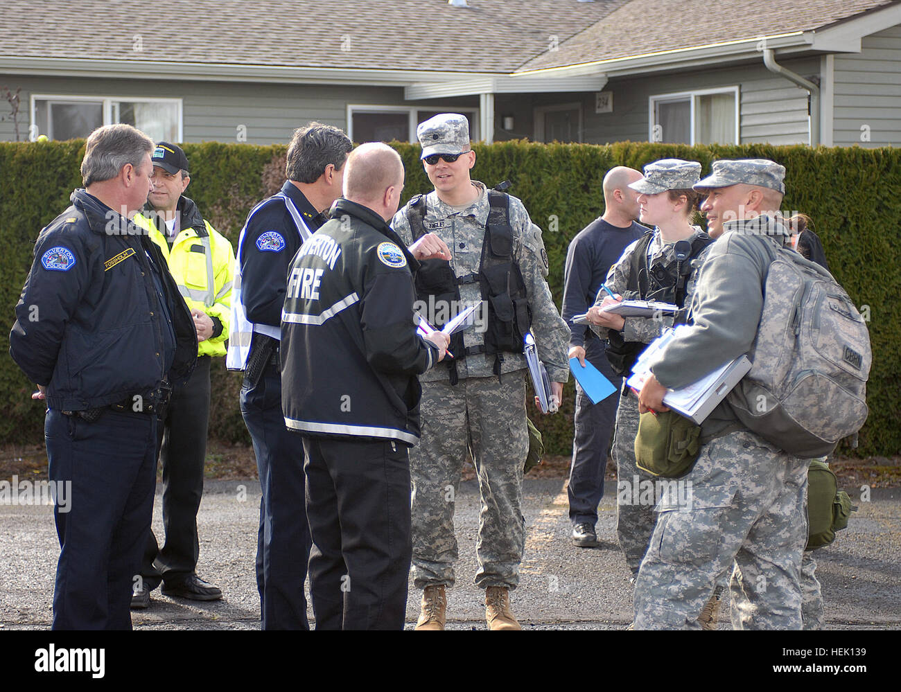 Lt. Col. Lance Englet, 102 Civil Support Team commander, receives a ...