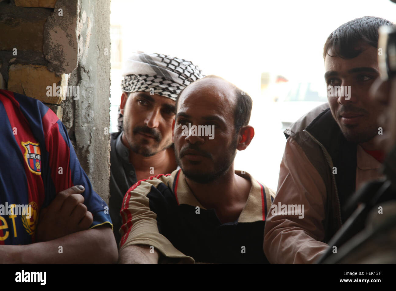 Iraqi citizens listen on how to properly request aid from the Iraqi ...