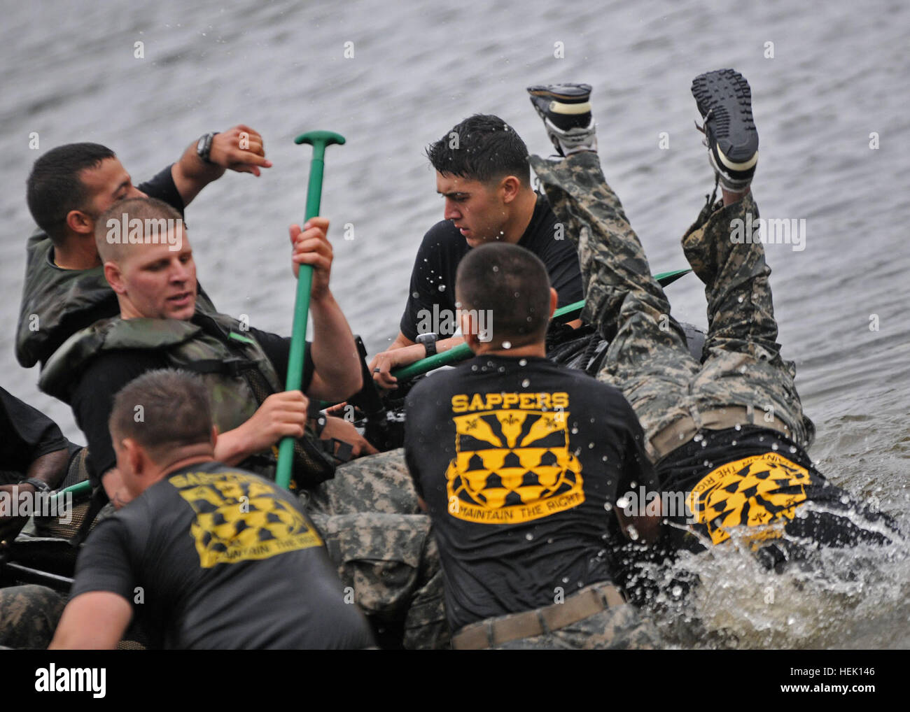 A Sapper from 307th Engineer Battalion dives head first into the water ...