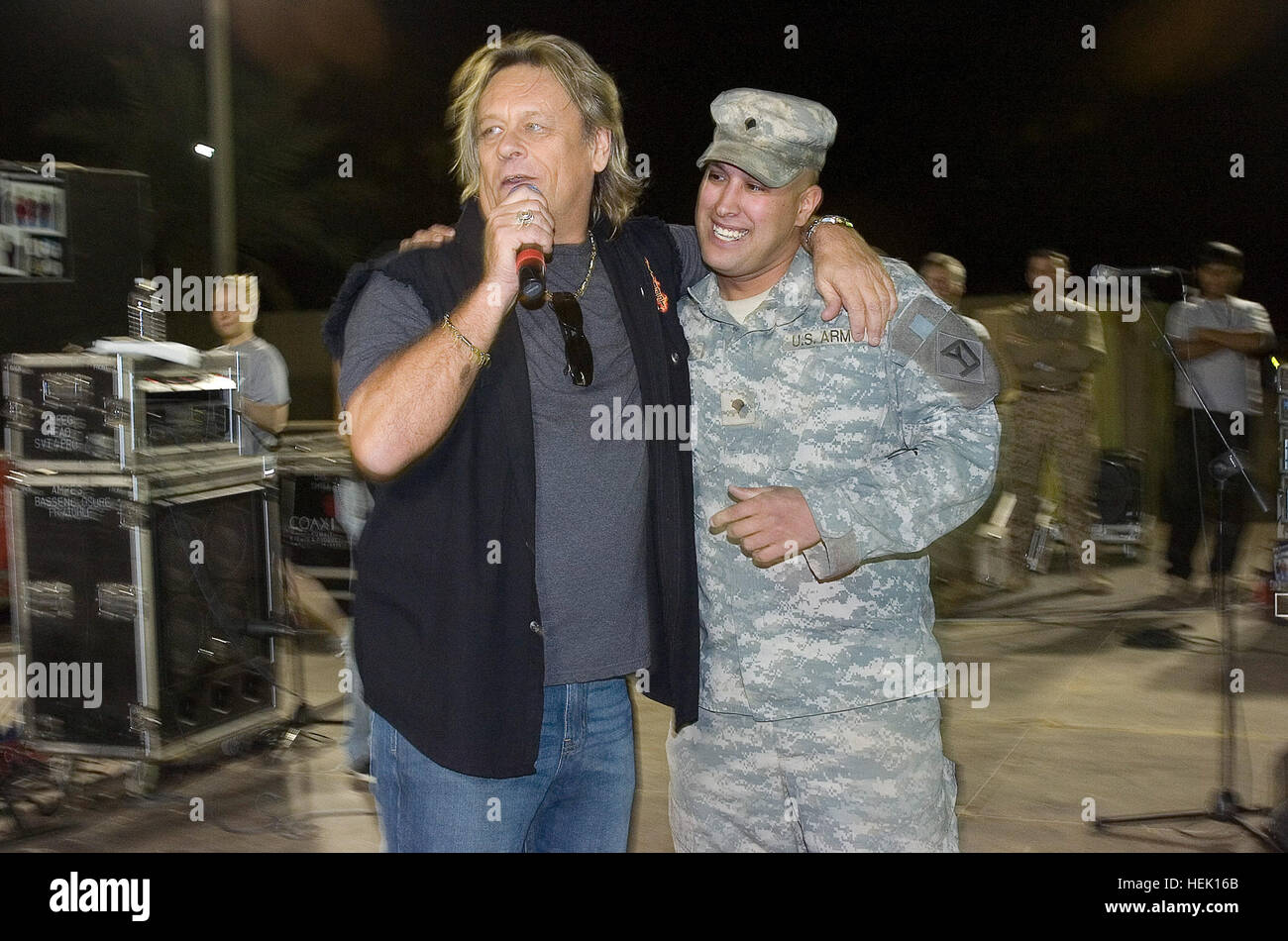 Vocalist Brian Howe pulls Spc. Joseph Mato, from Boston Mass., on stage ...