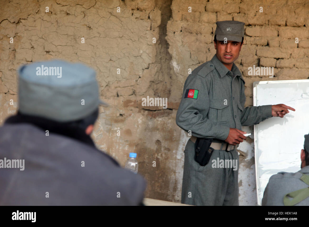 A non-commissioned officer in the Afghan national police teaches a ...