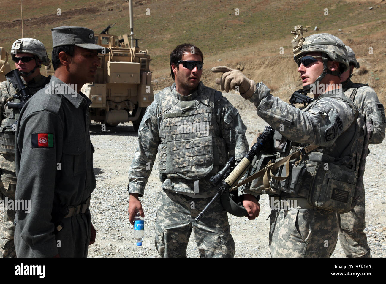 Soldiers from the 118th Military Police company and an interpreter ...