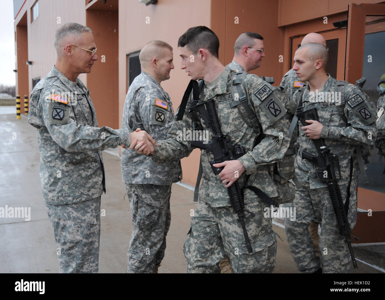 Maj. Gen James Terry, commander of the 10th Mountain Division, shakes ...