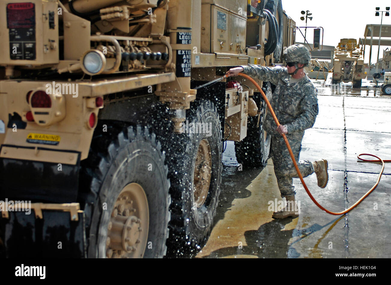 Sgt. Matthew Tigner sprays down a Mine Resistant Ambush Protected ...