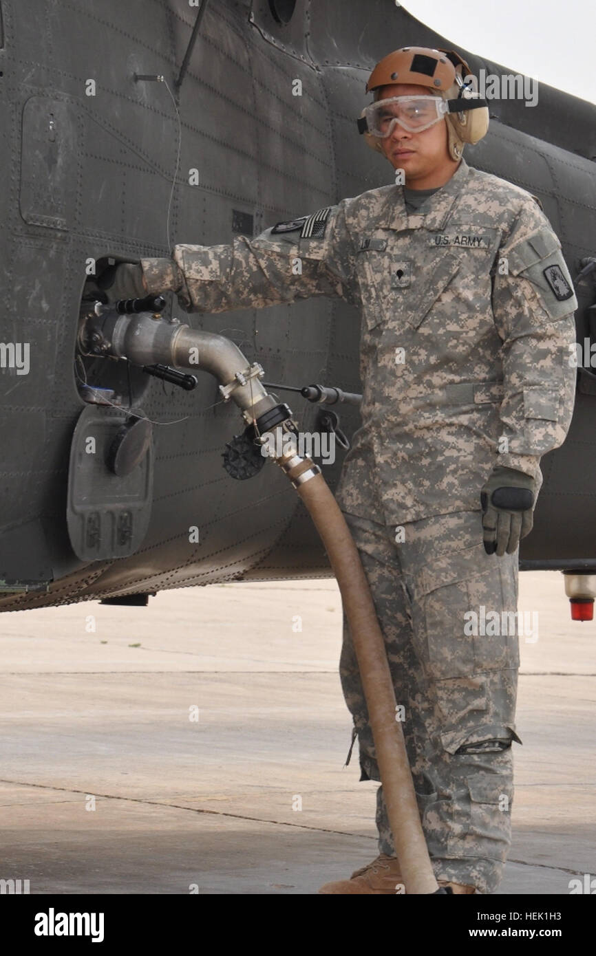 Army Spc. John Lim, Manila, Philippines, a Task Force 38 fueler with E ...